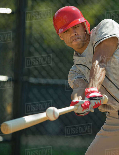 Baseball batter hitting ball - Royalty-free Stock Photo | Dissolve