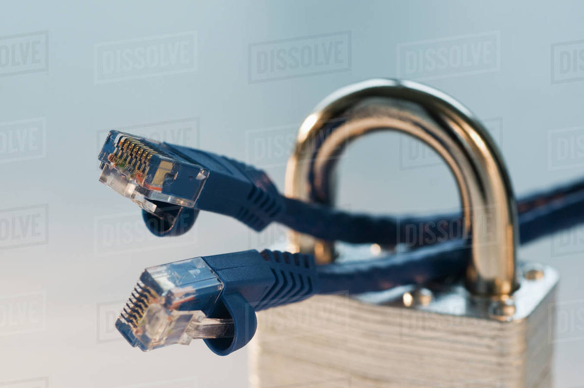 Close up of lock and ethernet cables - Stock Photo - Dissolve