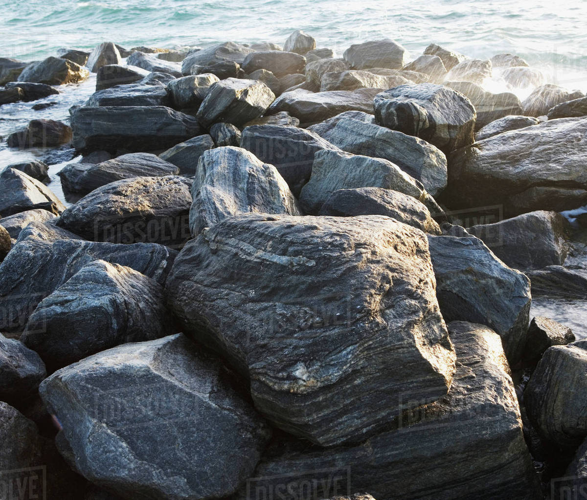Rocks in front of water - Royalty-free Stock Photo | Dissolve