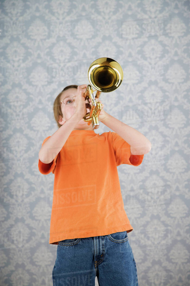 Boy playing trumpet - Royalty-free Stock Photo | Dissolve