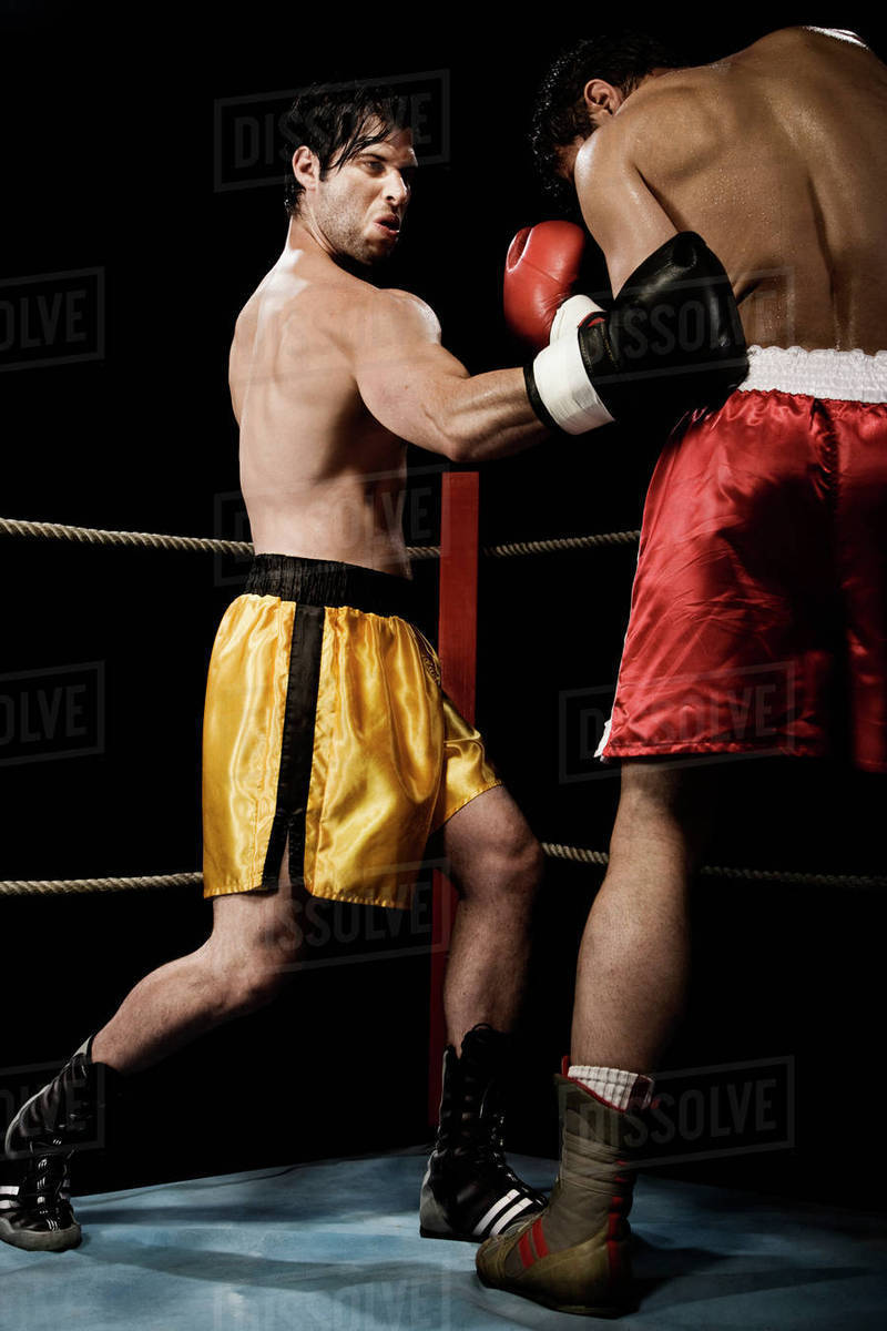 Boxers fighting in boxing ring - Royalty-free Stock Photo | Dissolve