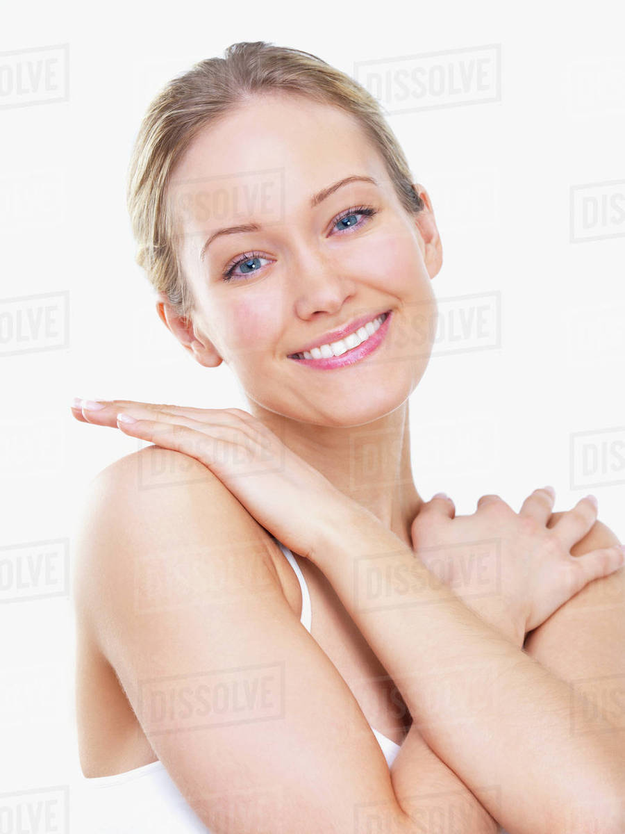 Woman with hands on shoulders - Stock Photo - Dissolve