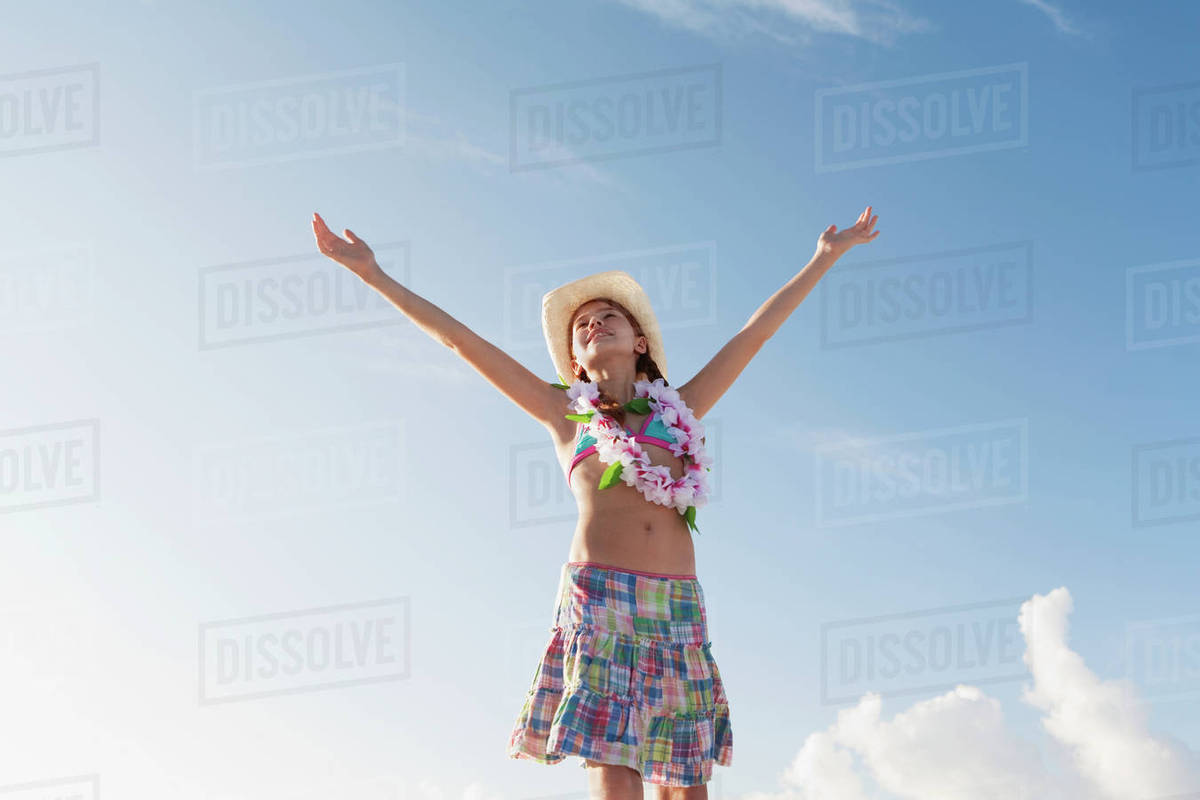 Girl in bathing suit with lei around neck - Stock Photo - Dissolve
