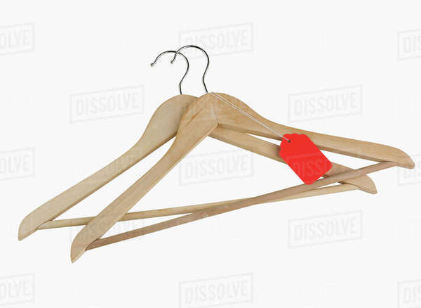 Studio shot of wooden hangers - Stock Photo - Dissolve