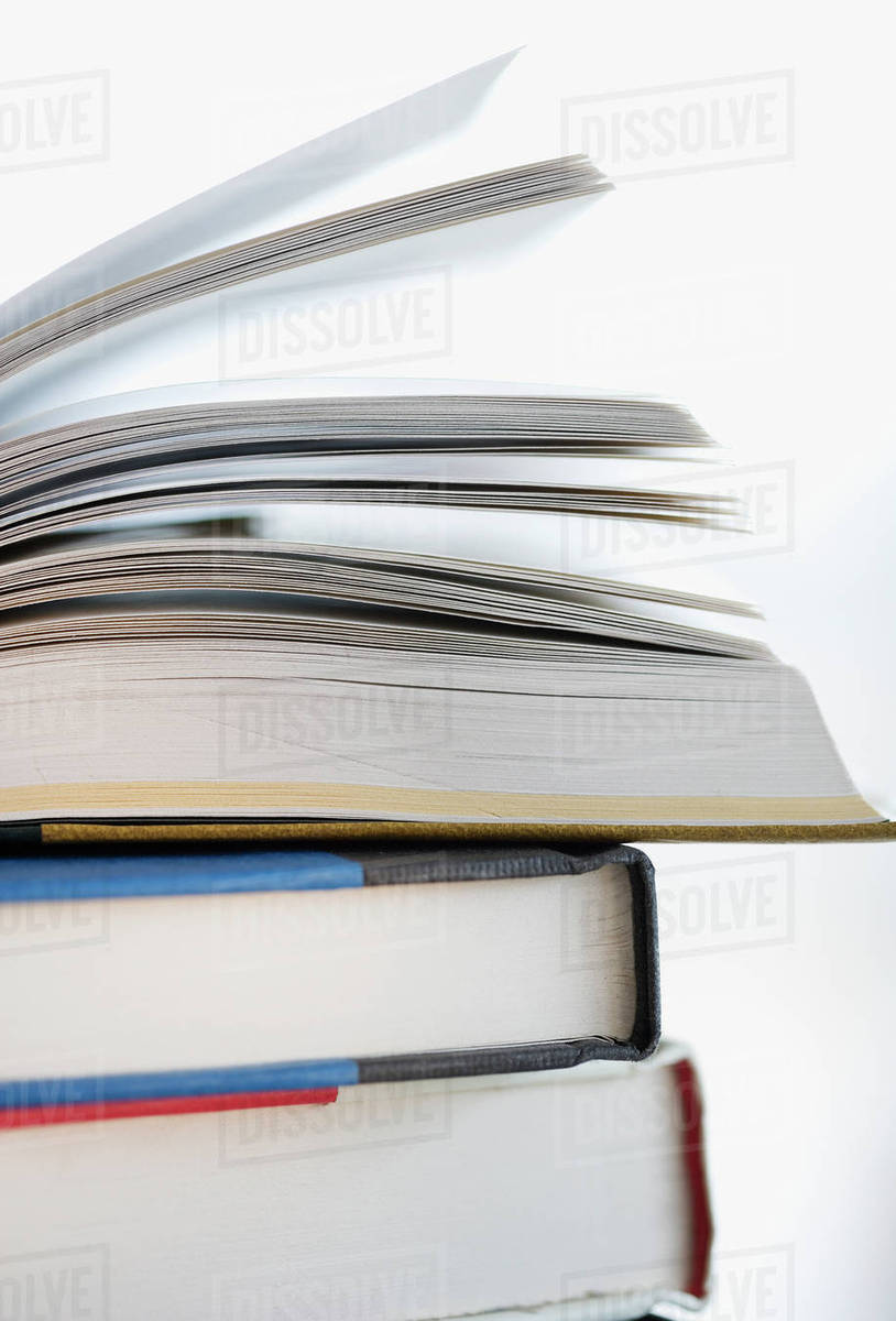 Close up of stack of books - Stock Photo - Dissolve