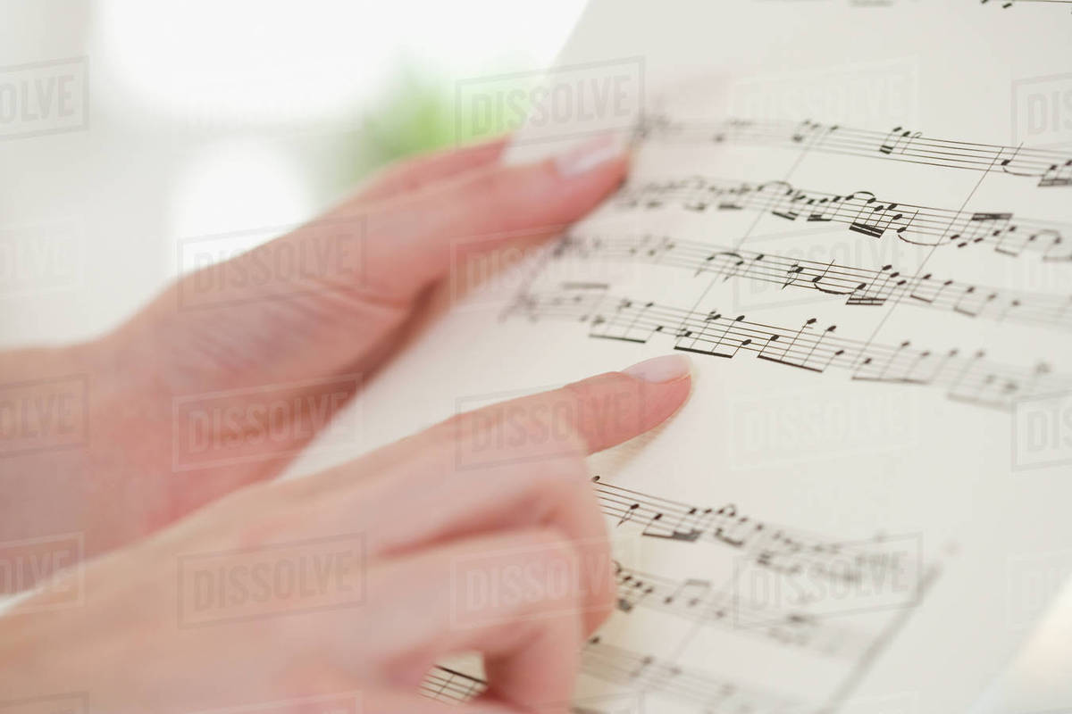 Close up of woman pointing at sheet music - Royalty-free Stock Photo ...