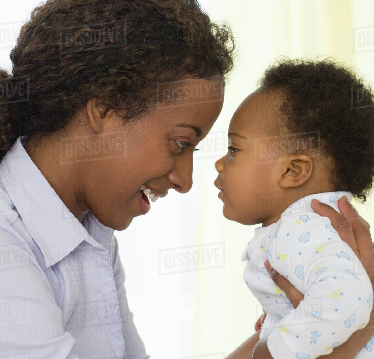 Mother smiling at baby - Royalty-free Stock Photo | Dissolve
