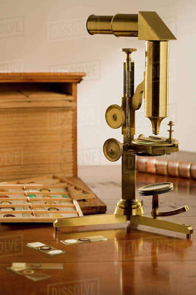Old fashioned microscope and slides on table - Royalty-free Stock Photo ...