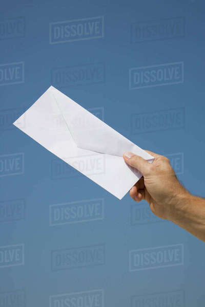 Man holding envelope - Stock Photo - Dissolve