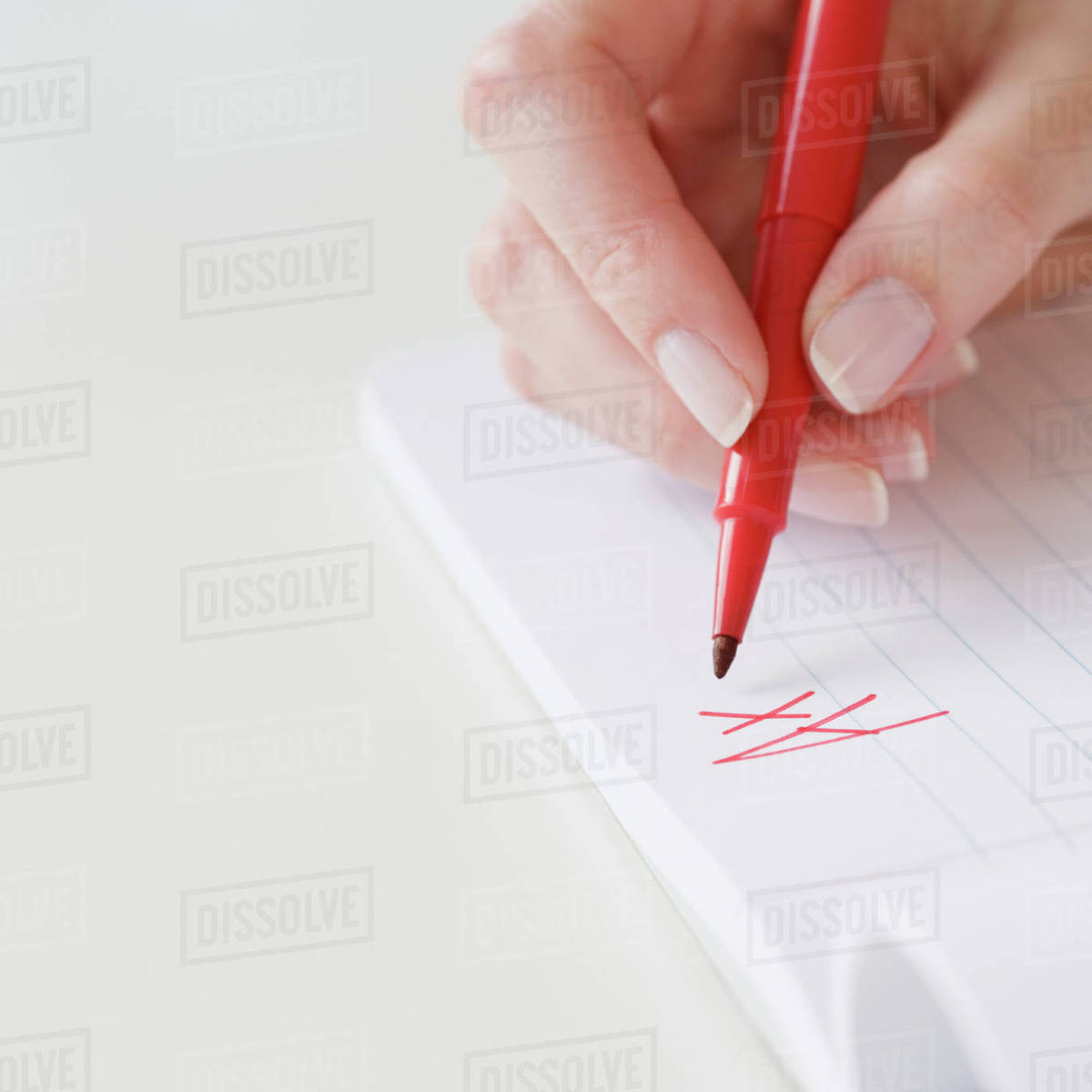 Teacher writing A plus on paper - Royalty-free Stock Photo | Dissolve