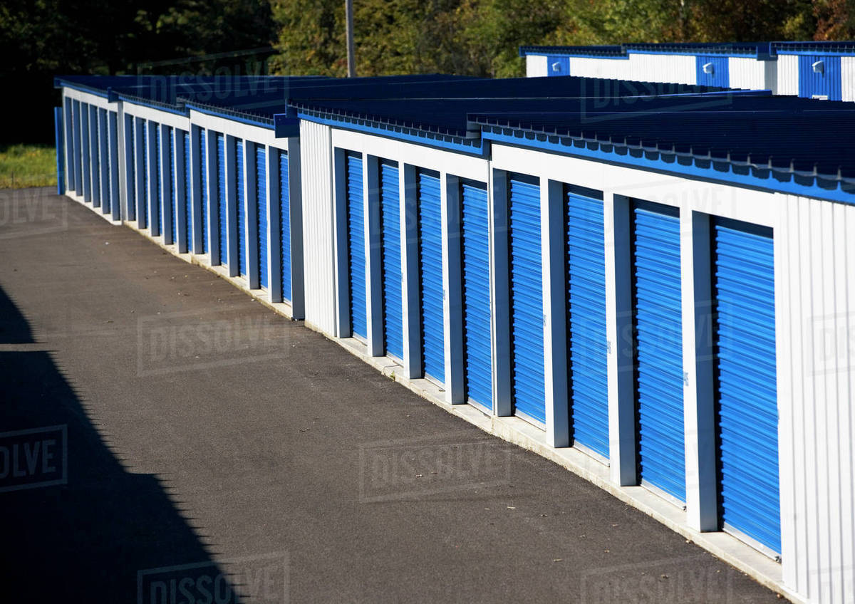 Row of outdoor self storage units - Stock Photo - Dissolve