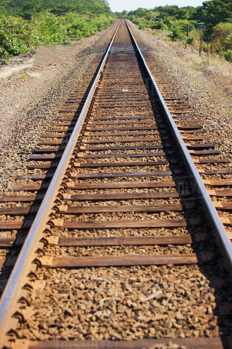 Railroad track in rural area - Royalty-free Stock Photo | Dissolve