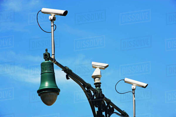 Security cameras on lamp post - Stock Photo - Dissolve