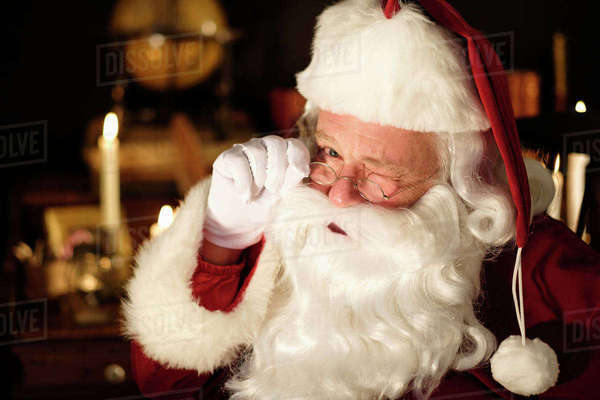 Portrait of Santa Claus winking - Stock Photo - Dissolve