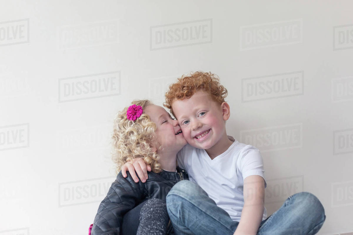 Portrait of two siblings (4-5, 8-9) - Royalty-free Stock Photo | Dissolve