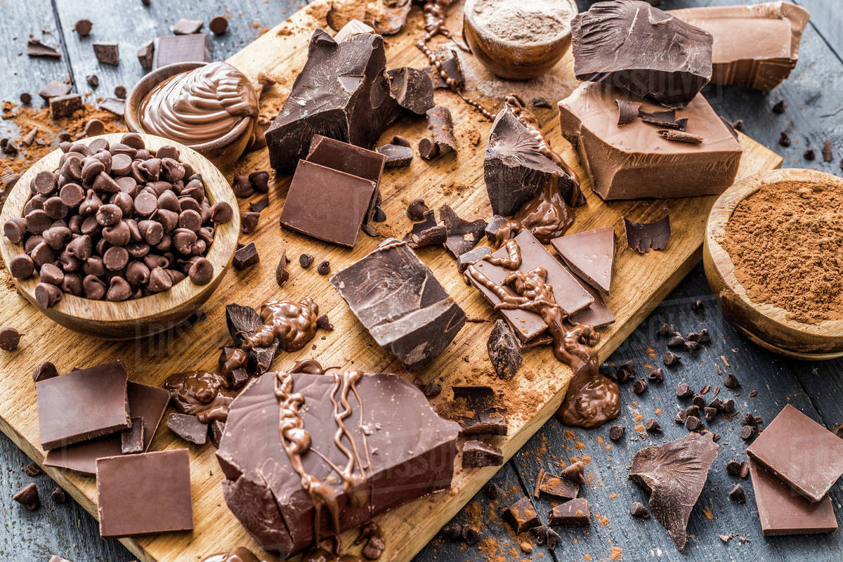 Various chocolate pieces on cutting board - Royalty-free Stock Photo ...