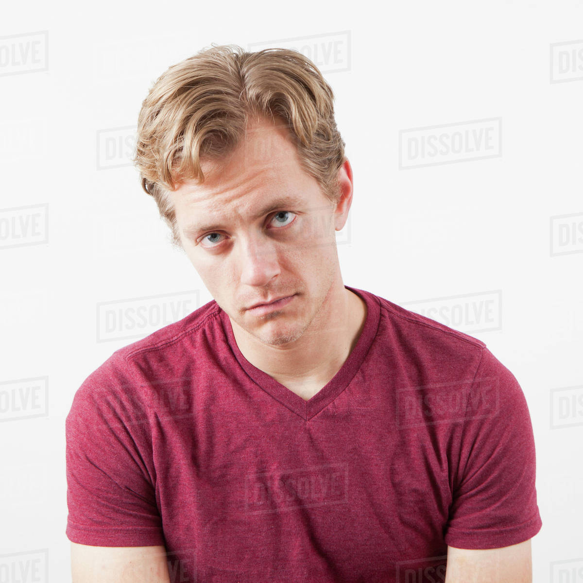 Portrait of sad man looking at camera - Royalty-free Stock Photo | Dissolve