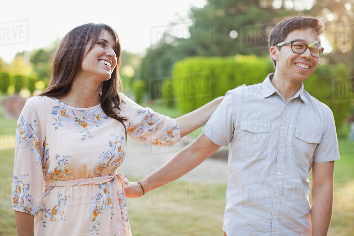 Couple hanging out in park - Royalty-free Stock Photo | Dissolve
