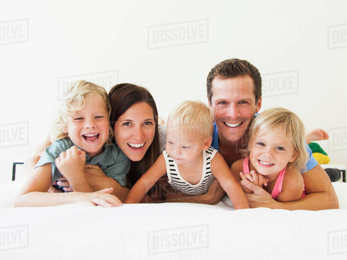 Portrait of family with three kids (6-7, 2-3, 6-11 months) - Royalty ...