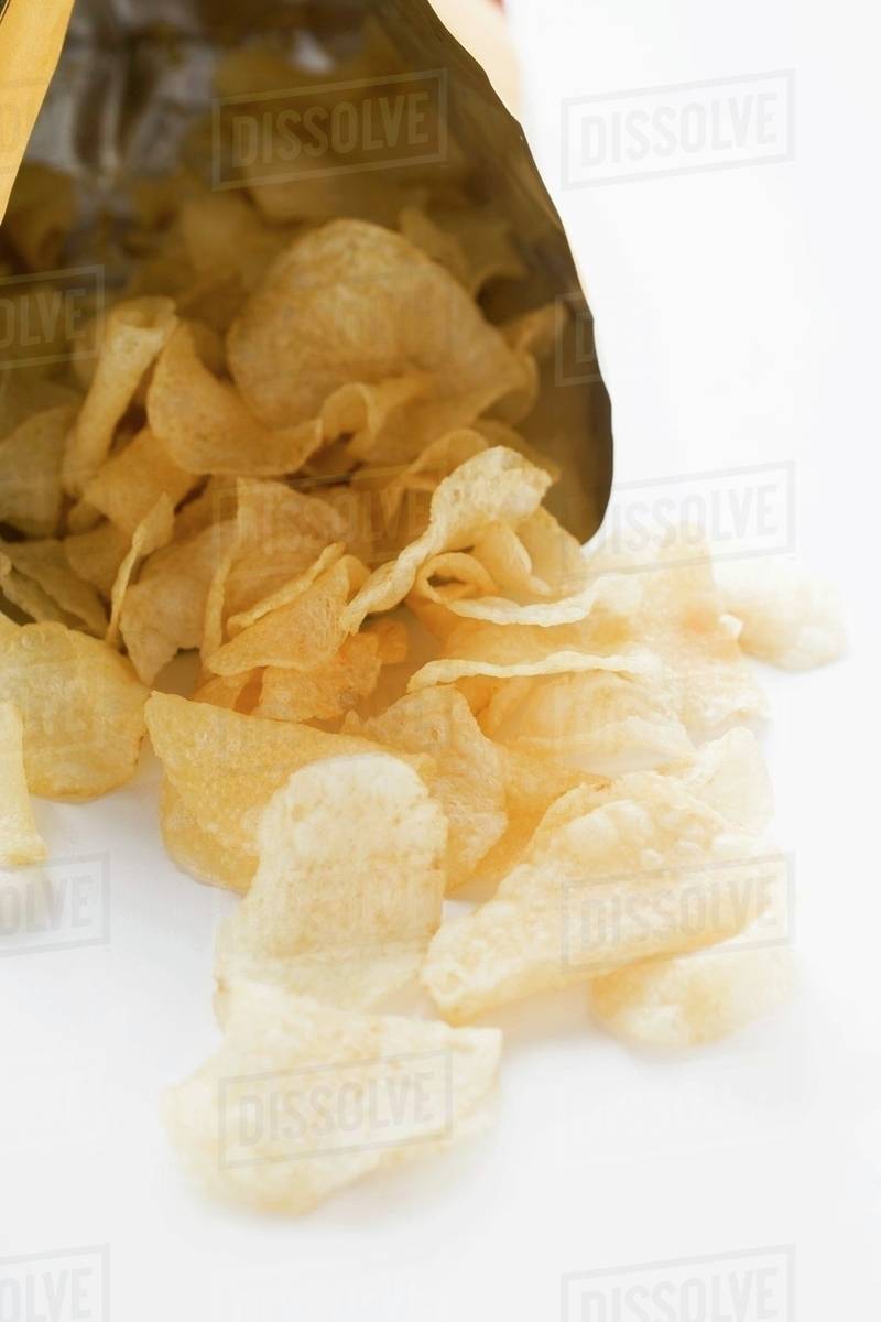 Potato crisps in opened bag - Royalty-free Stock Photo | Dissolve