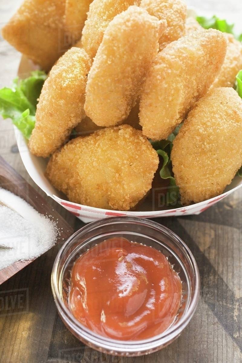 Chicken Nuggets in cardboard dish, ketchup, salt - Royalty-free Stock ...