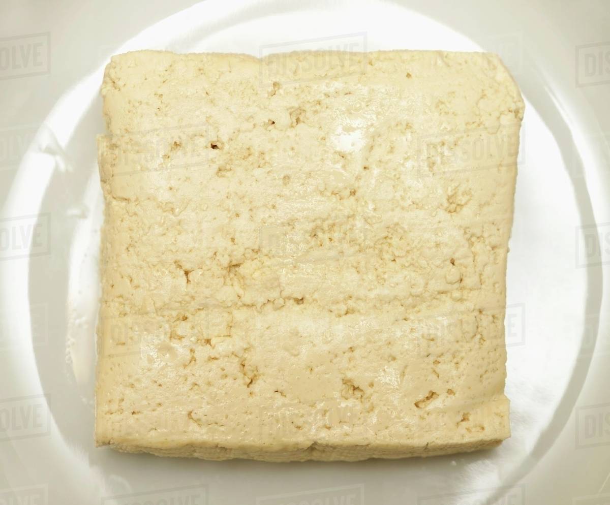 Slice of tofu on plate - Royalty-free Stock Photo | Dissolve