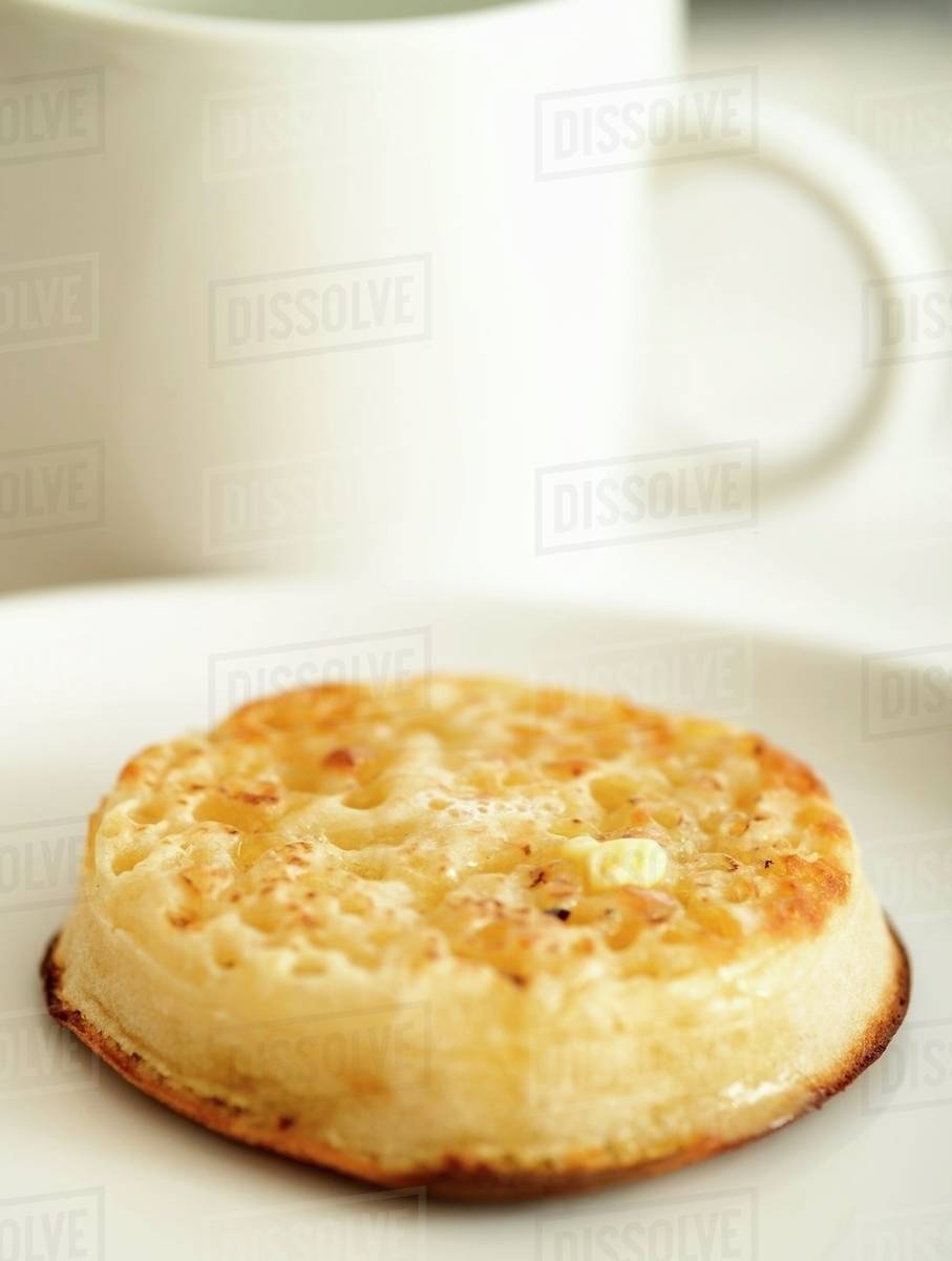 Toasted crumpet with butter - Royalty-free Stock Photo | Dissolve