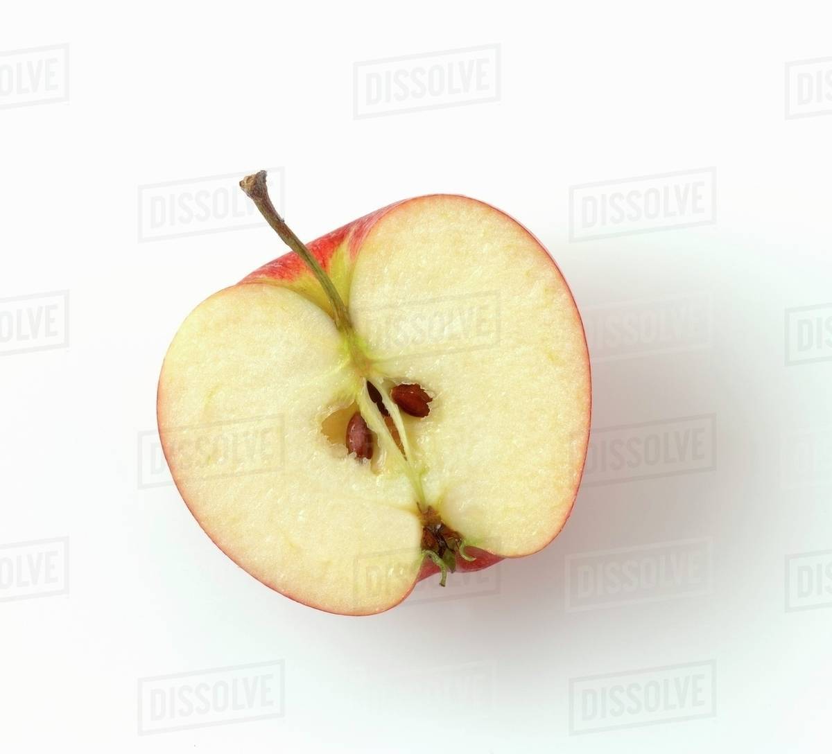 Half an apple, seen from above - Stock Photo - Dissolve