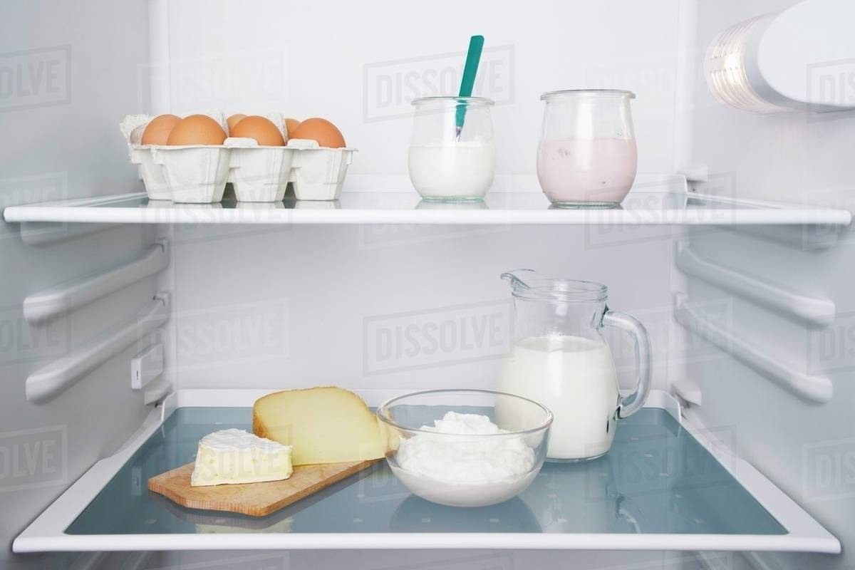 An open fridge with dairy products - Royalty-free Stock Photo | Dissolve