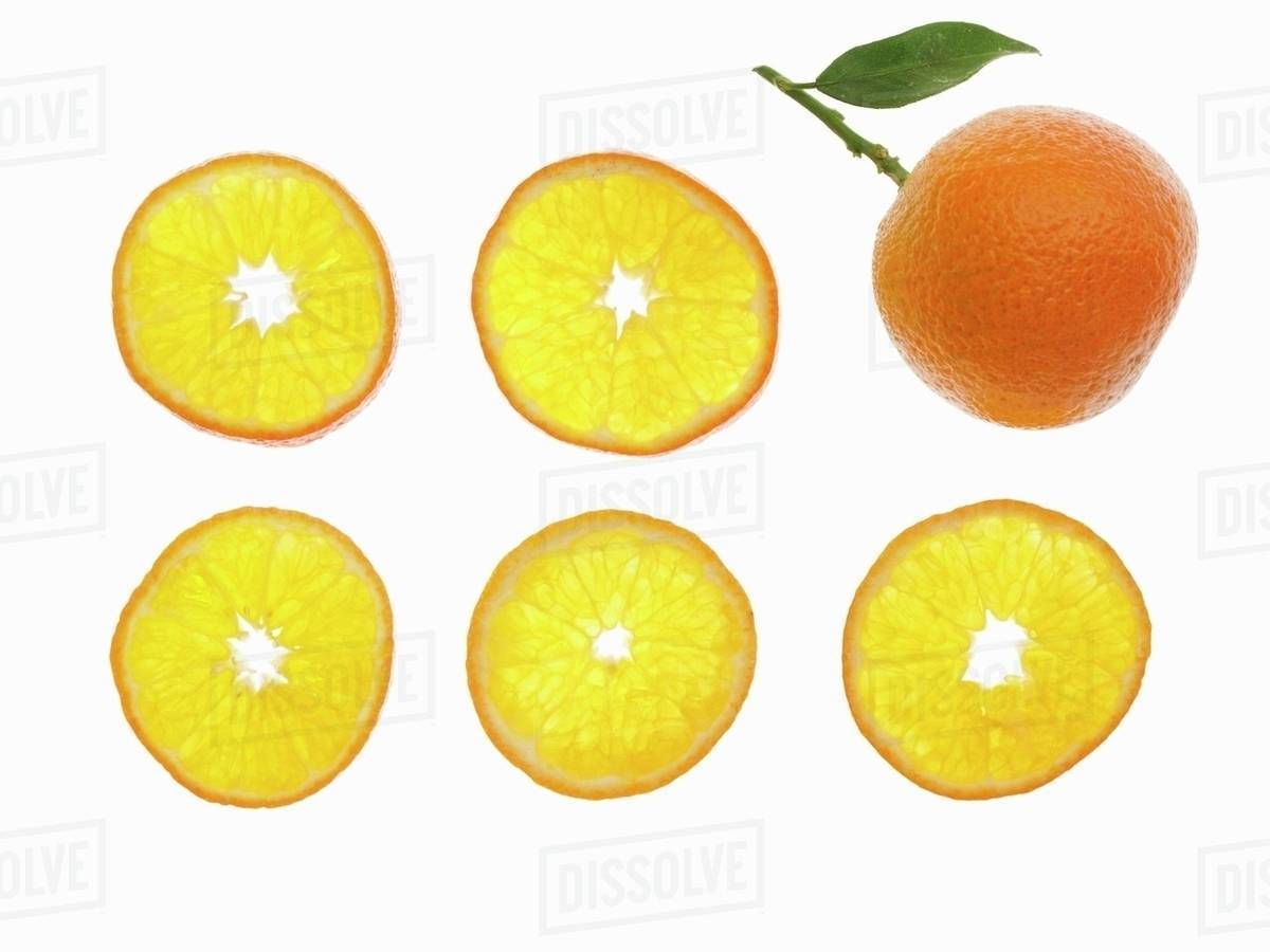 A whole mandarin and mandarin slices - Royalty-free Stock Photo | Dissolve