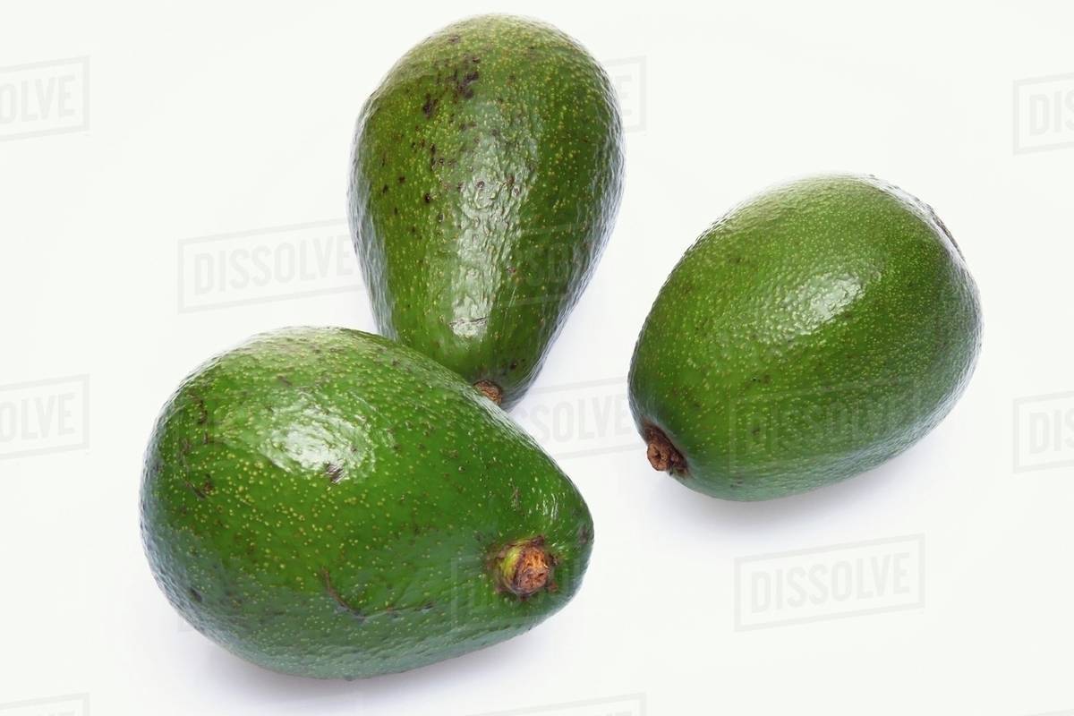 Three whole avocados - Stock Photo - Dissolve