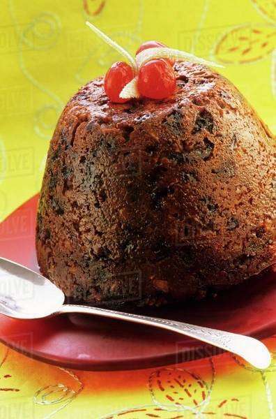 Plum pudding with candided fruits - Royalty-free Stock Photo | Dissolve