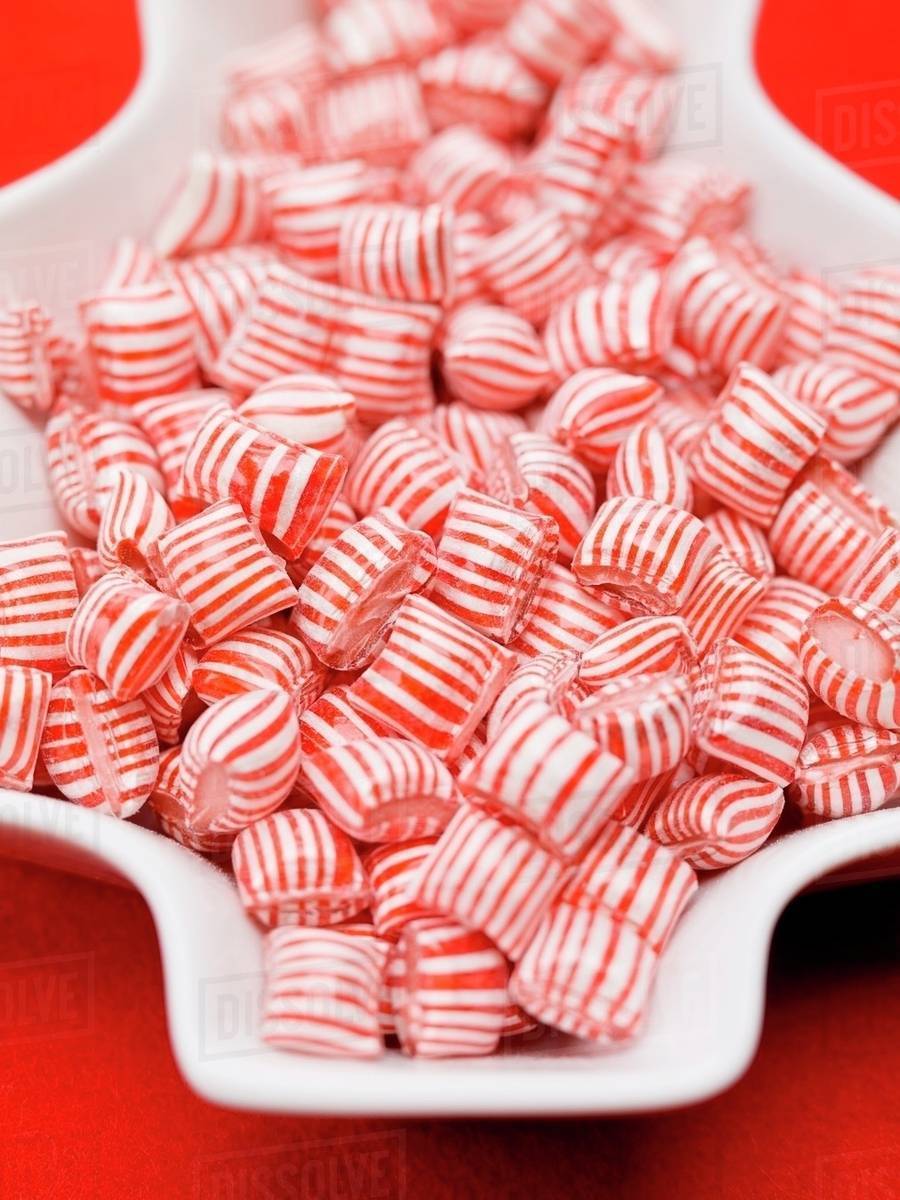 Red and white striped peppermints in dish - Royalty-free Stock Photo ...