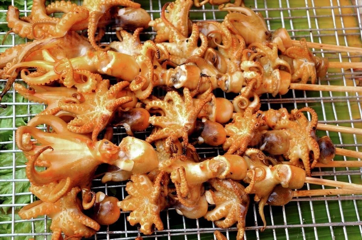 Barbecued squid skewers - Royalty-free Stock Photo | Dissolve