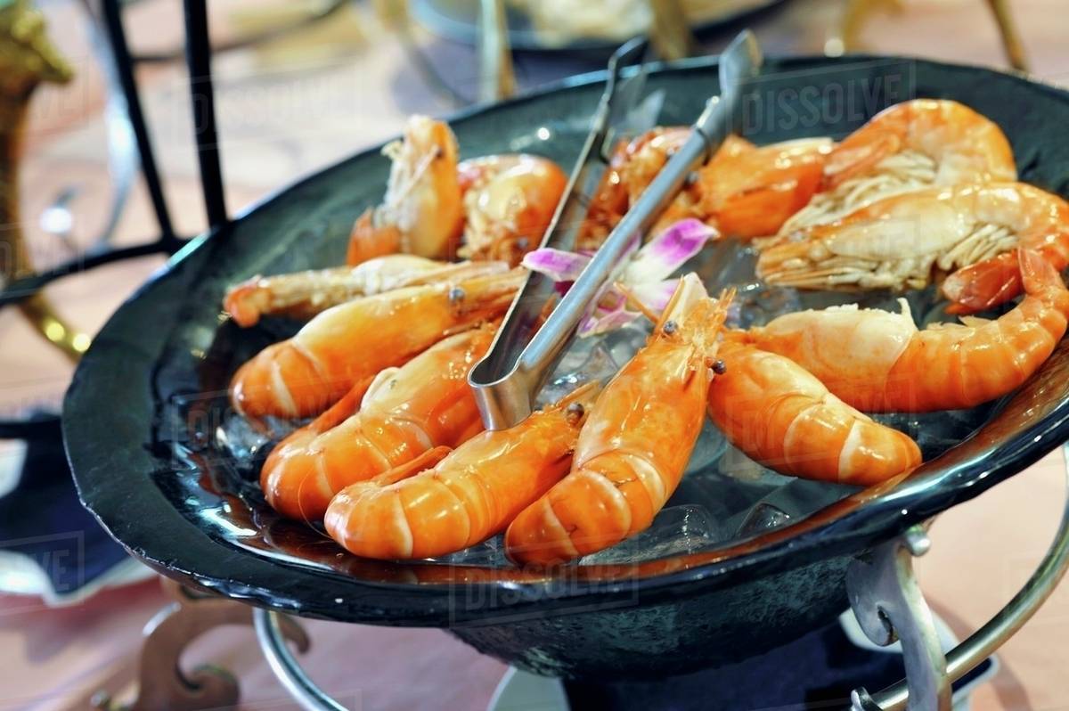 Cooked prawns on ice cubes, Thailand - Royalty-free Stock Photo | Dissolve