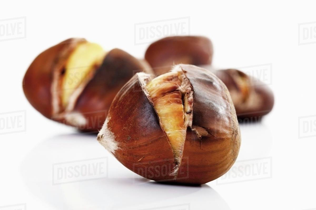Sweet chestnuts, roasted (close-up) - Stock Photo - Dissolve