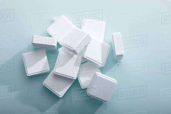 Glucose tablets on blue background - Stock Photo - Dissolve