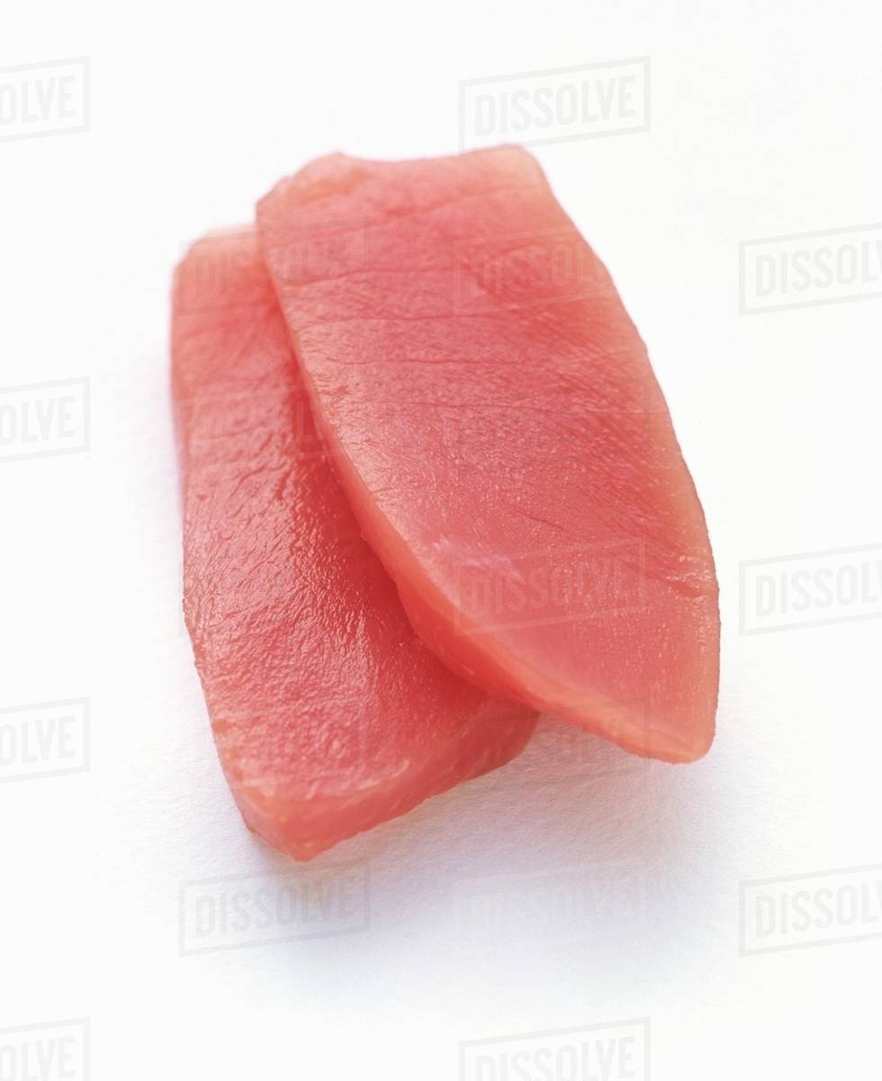 Two Slices of Raw Tuna - Stock Photo - Dissolve