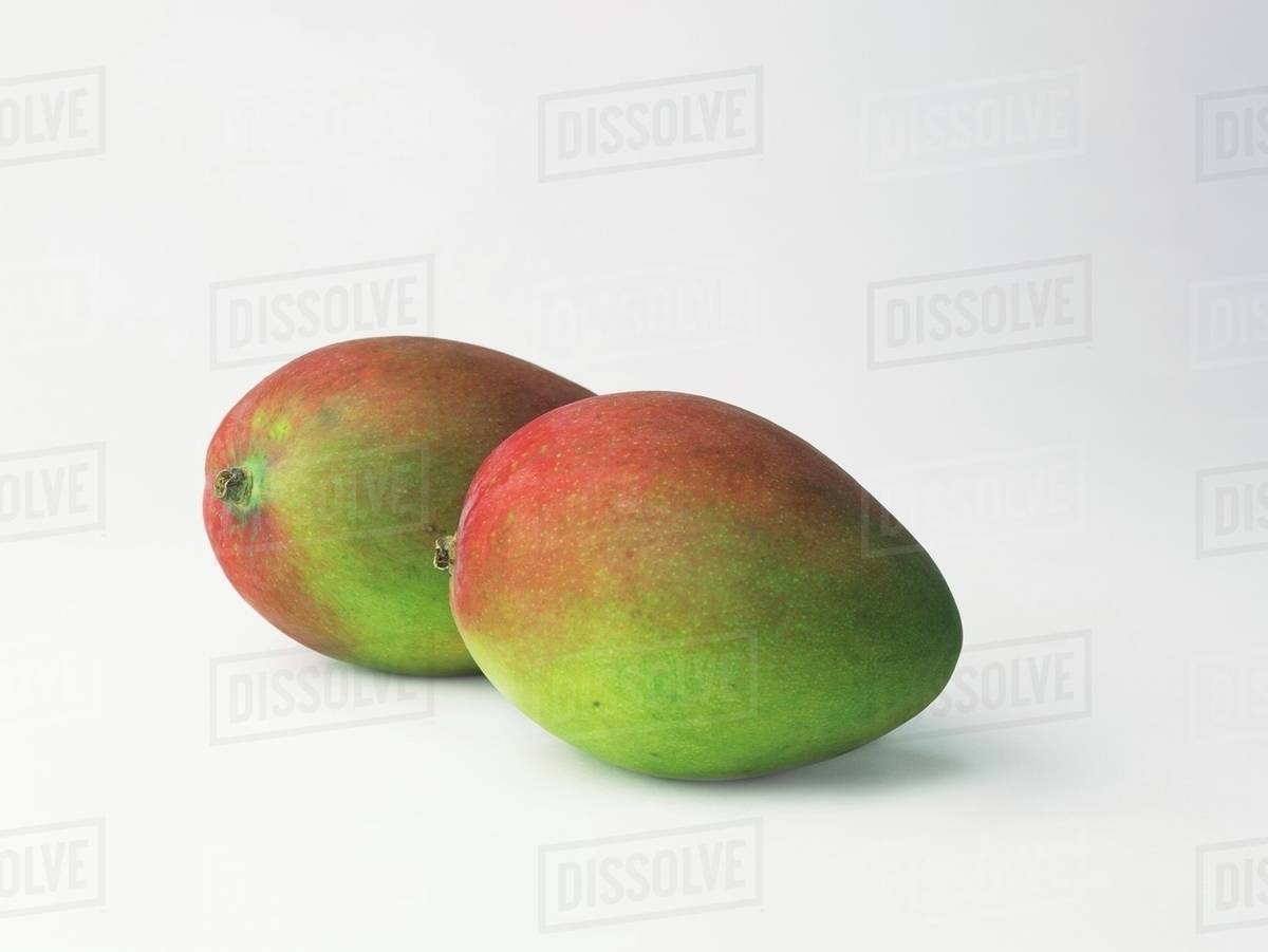 Two Mangos on White - Royalty-free Stock Photo | Dissolve