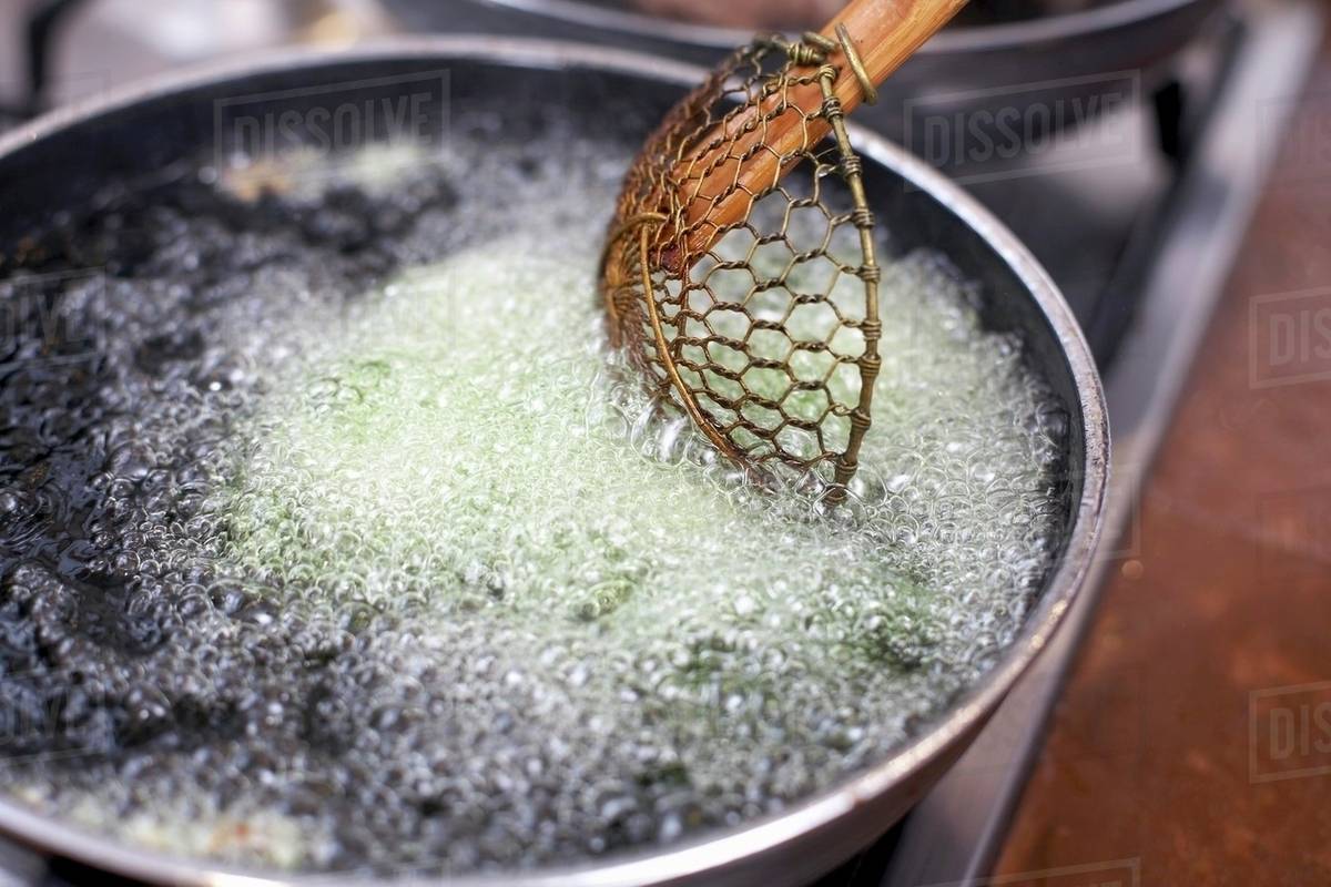 Fat bubbling in a frying pan - Royalty-free Stock Photo | Dissolve