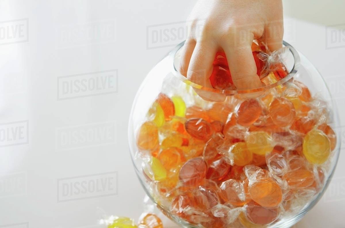 Child's hand reaching into a sweet jar - Royalty-free Stock Photo ...