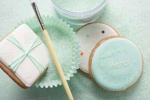 Pastel-coloured biscuits with coloured sugar (close-up) - Royalty-free ...