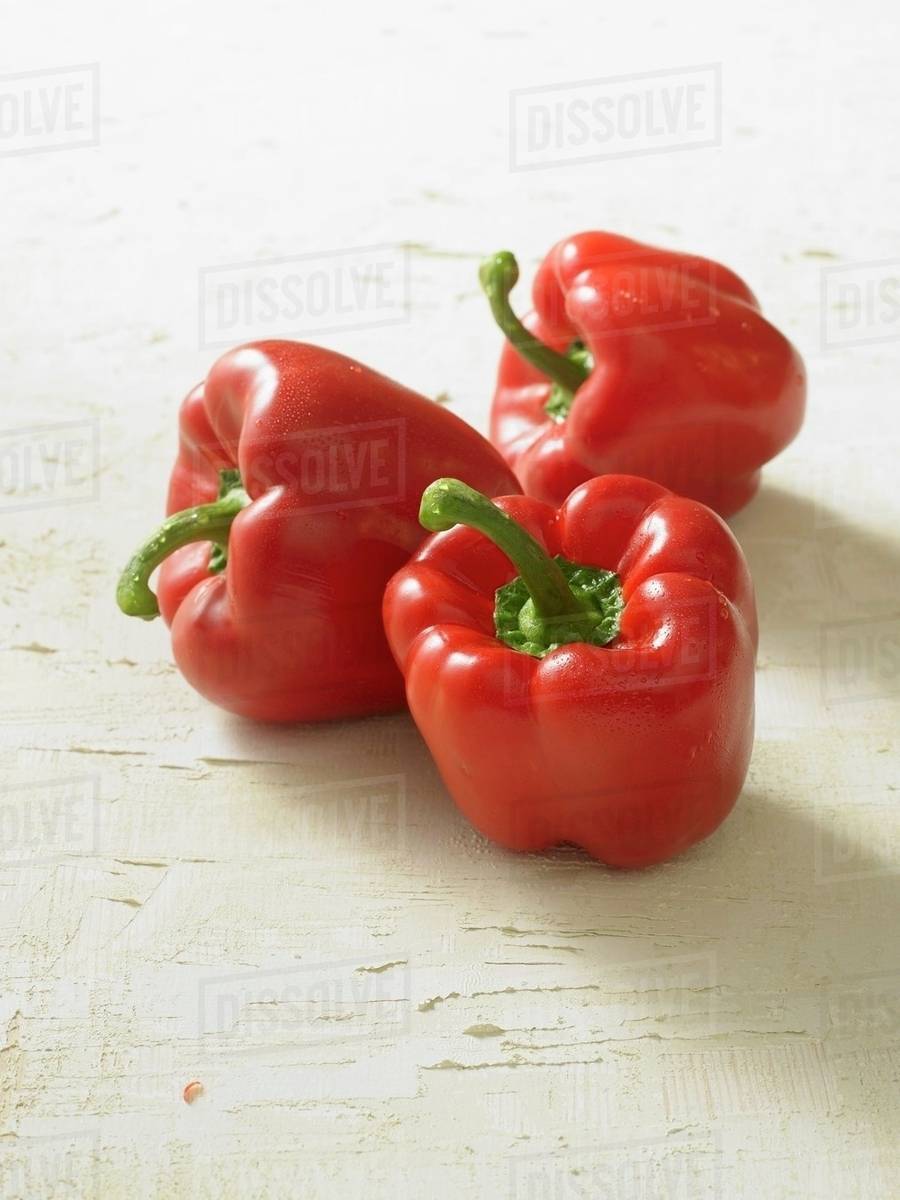 Three red peppers - Royalty-free Stock Photo | Dissolve