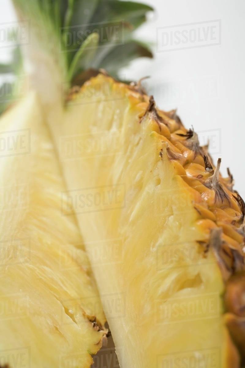 Two pineapple quarters (close-up) - Royalty-free Stock Photo | Dissolve