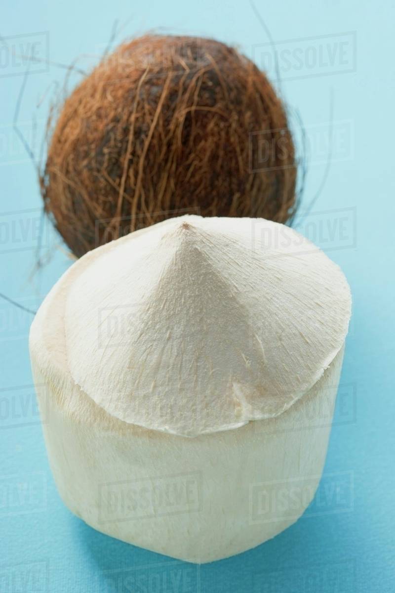 Coconuts, shelled and unshelled - Royalty-free Stock Photo | Dissolve