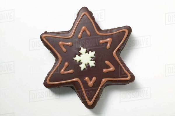 Star biscuit with chocolate icing - Royalty-free Stock Photo | Dissolve