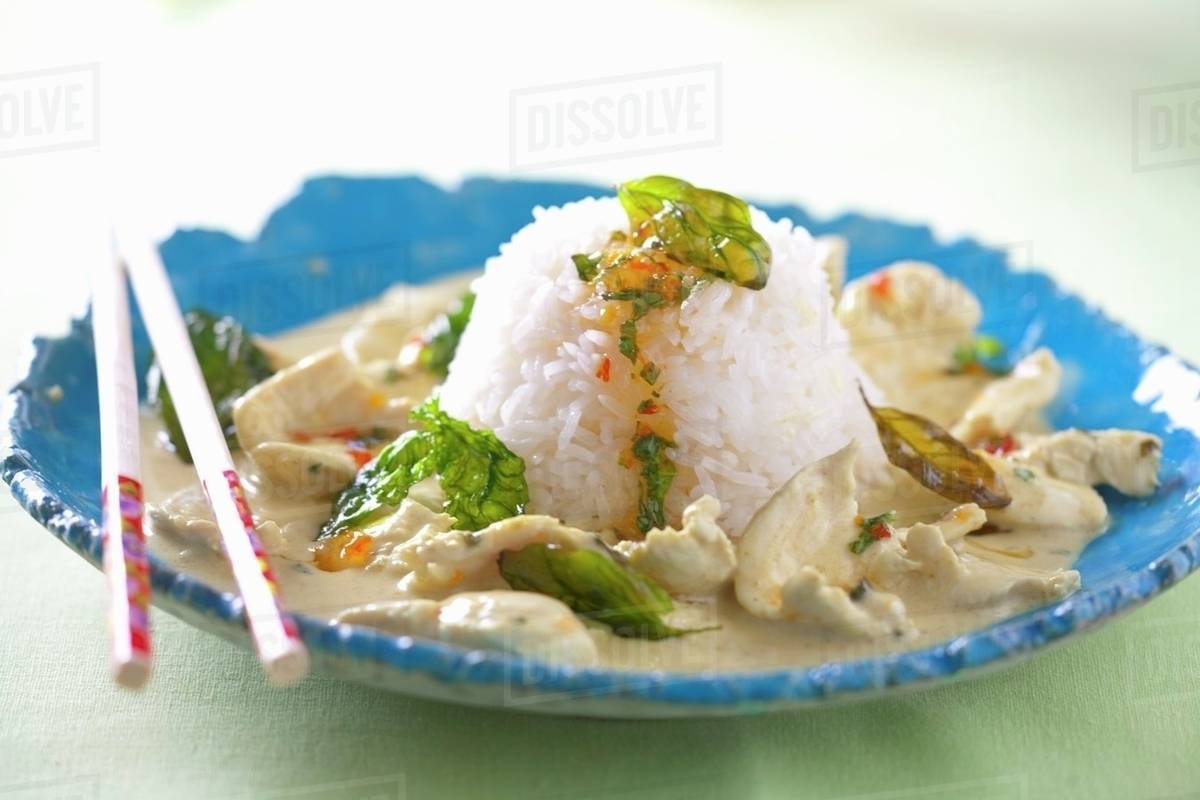 Chicken ragout with chilli sauce, fried basil and rice (Thailand ...