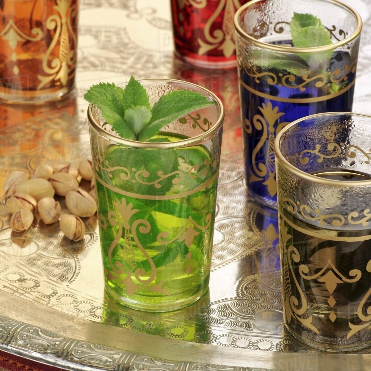 Peppermint tea in Middle Eastern glasses, pistachios - Royalty-free ...