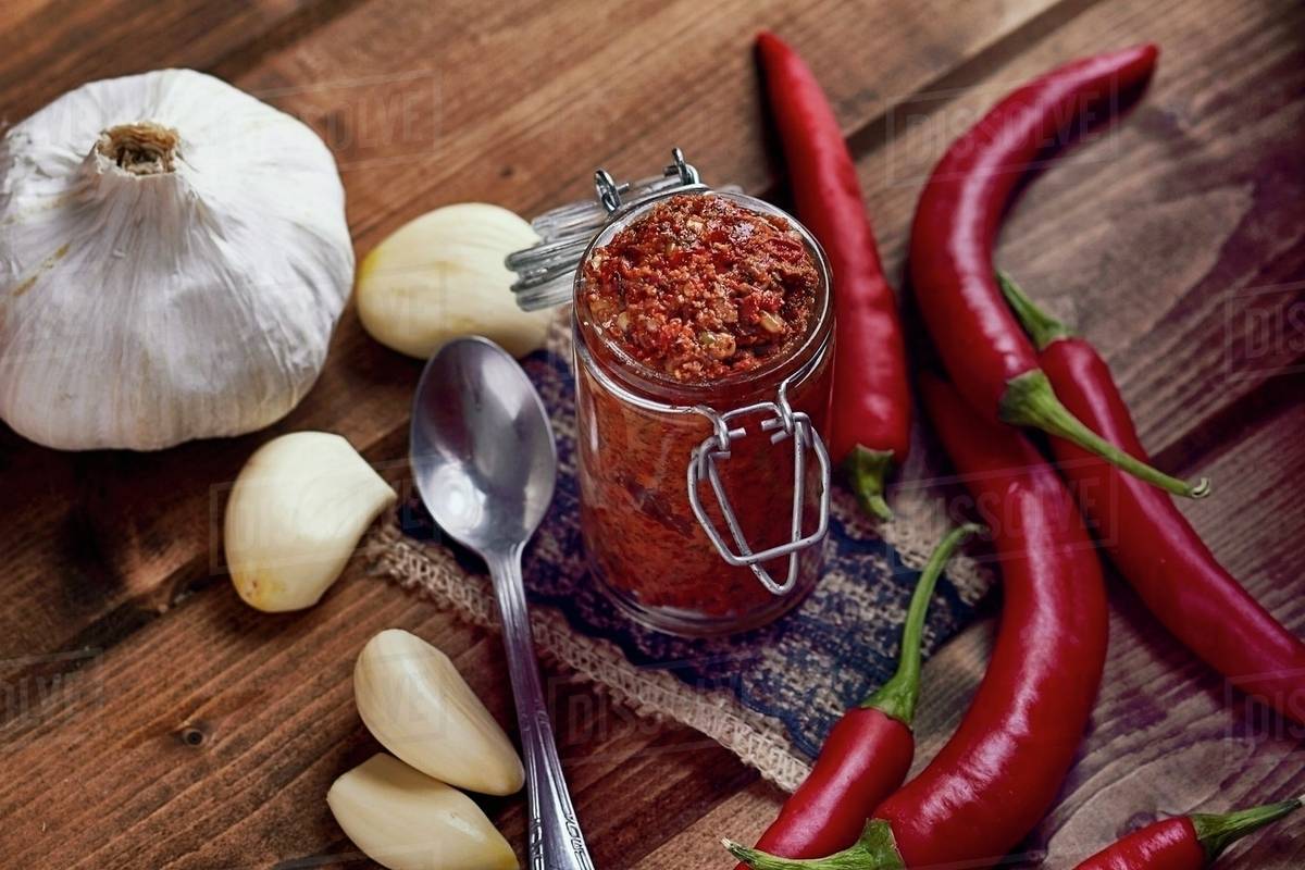 A jar of chilli paste surrounded by ingredients - Royalty-free Stock ...