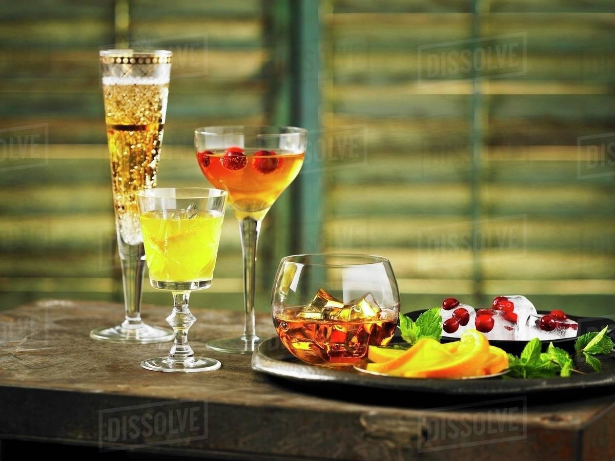 Various drinks and cocktails on a wooden table - Royalty-free Stock ...